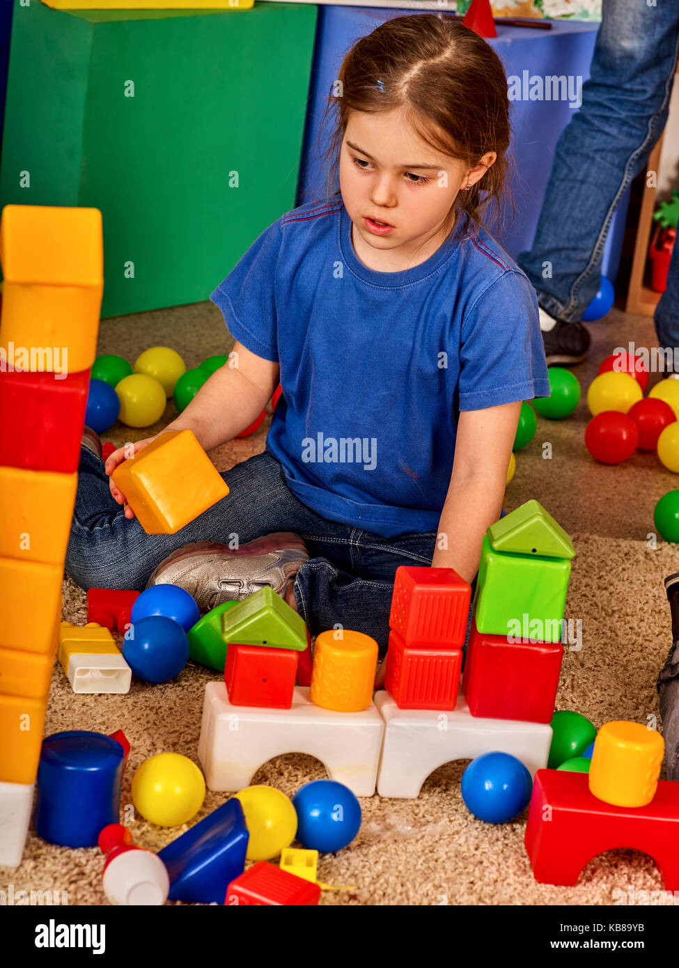 Children building blocks in kindergarten. Group kids playing toy floor ...
