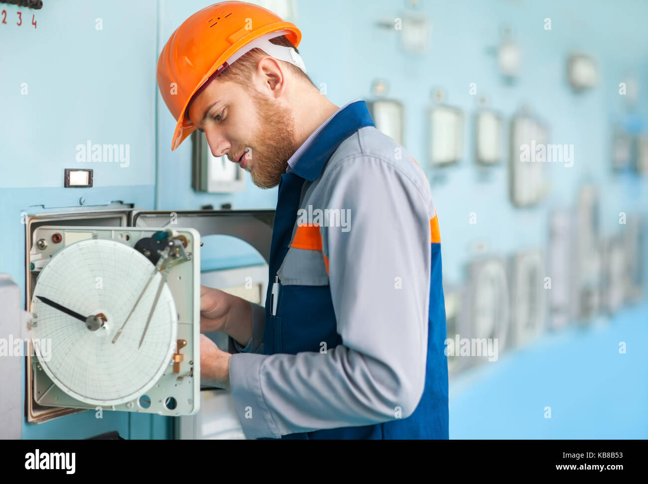 Portrait of young engineer working at control room in factory Stock ...