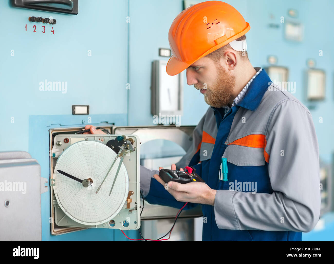 Portrait of young engineer working at control room in factory Stock ...