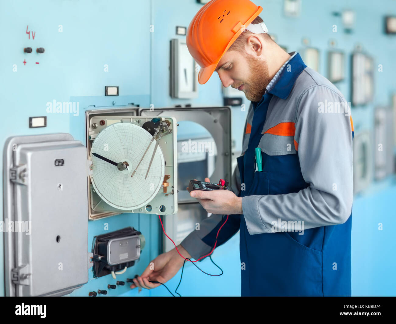 Portrait of young engineer working at control room in factory Stock ...