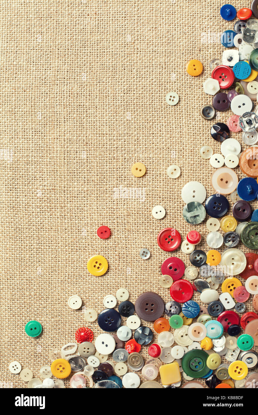 Colourful sewing buttons on fabric texture background with copy space ...