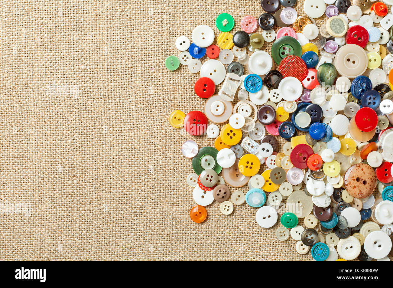 Colourful sewing buttons on fabric texture background with copy space ...