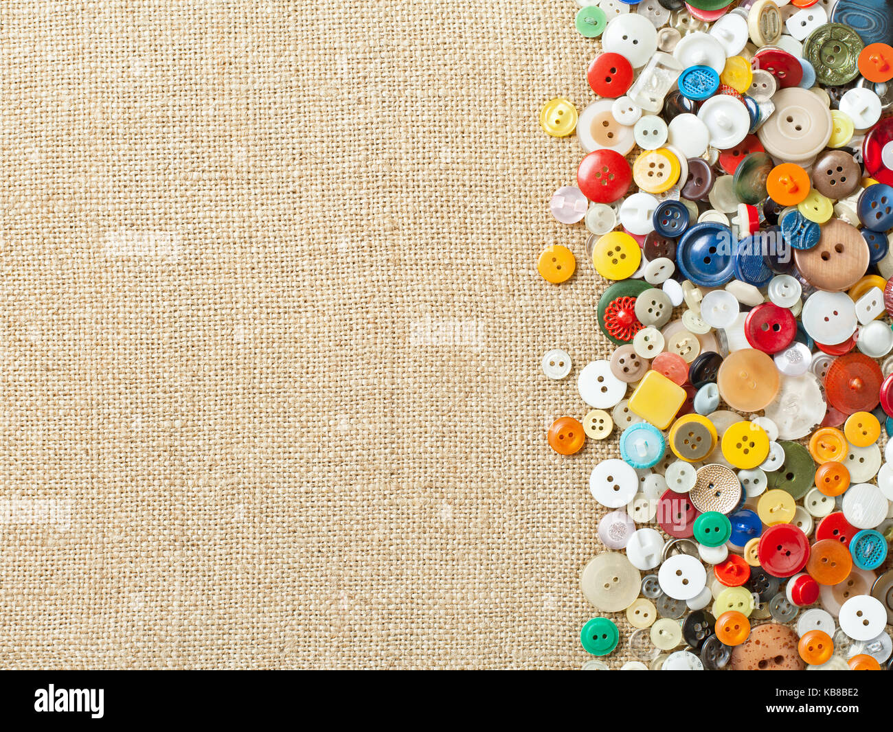 Colourful sewing buttons on fabric texture background with copy space ...