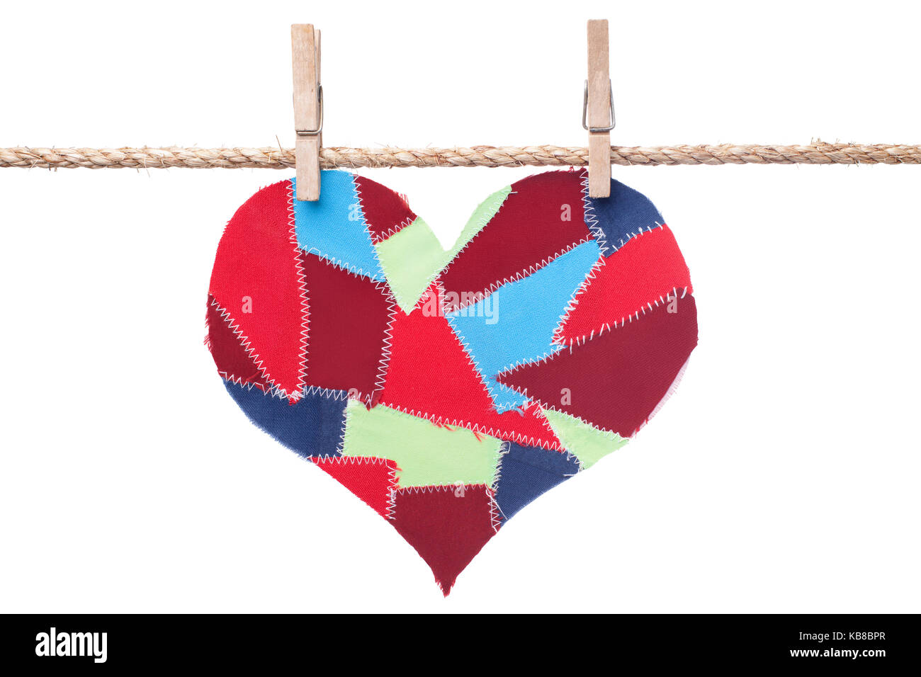 fabric scraps heart hanging on the clothesline. Isolated on white ...