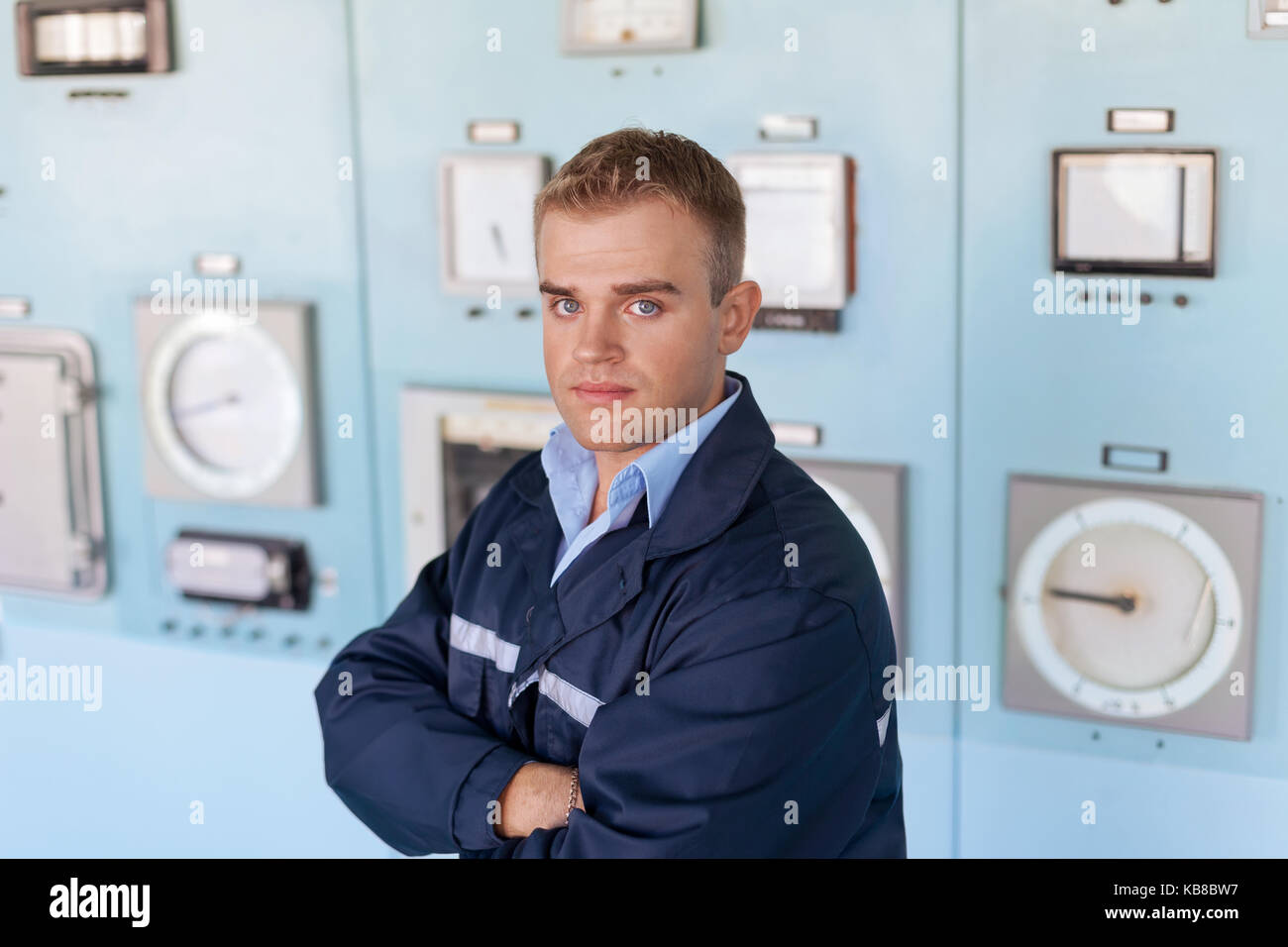 Portrait of young engineer at control room Stock Photo - Alamy