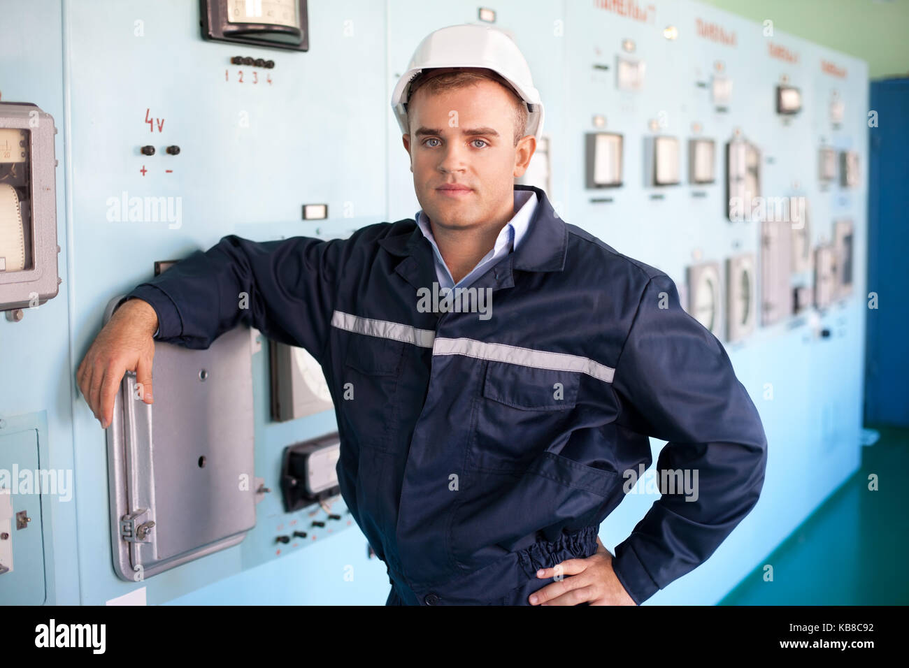 Portrait of young engineer at control room Stock Photo - Alamy