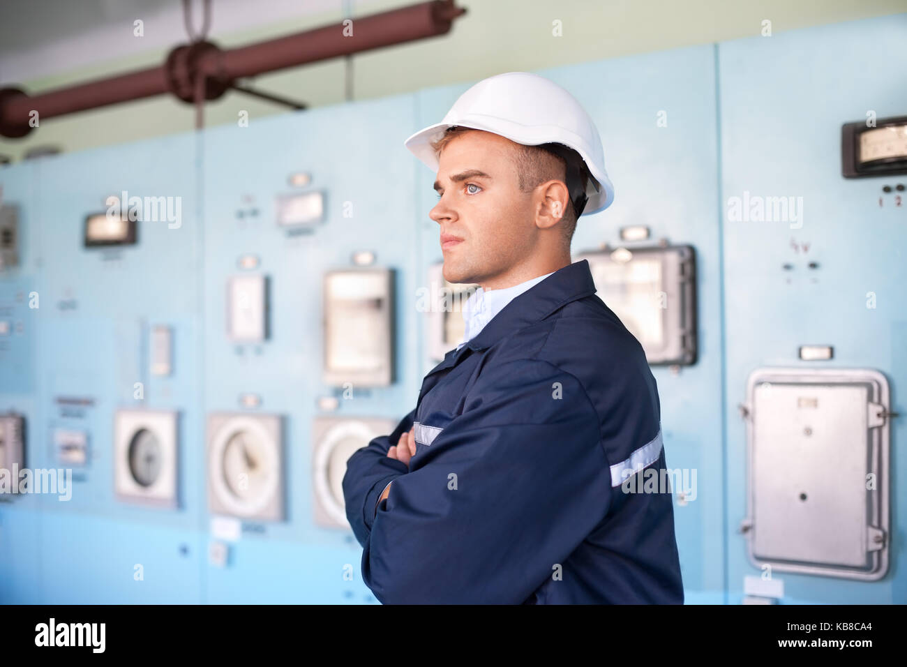 Portrait of young engineer in control room Stock Photo - Alamy