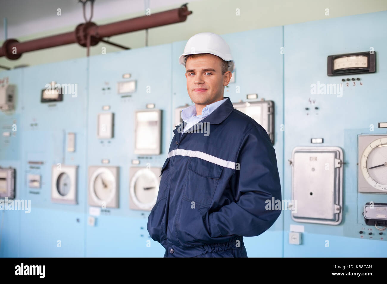 Portrait of young engineer at control room Stock Photo - Alamy