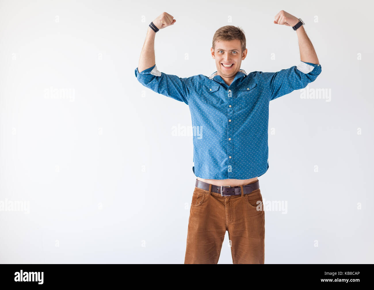 Portrait of a handsome cheerful man with raised hand up Stock Photo - Alamy