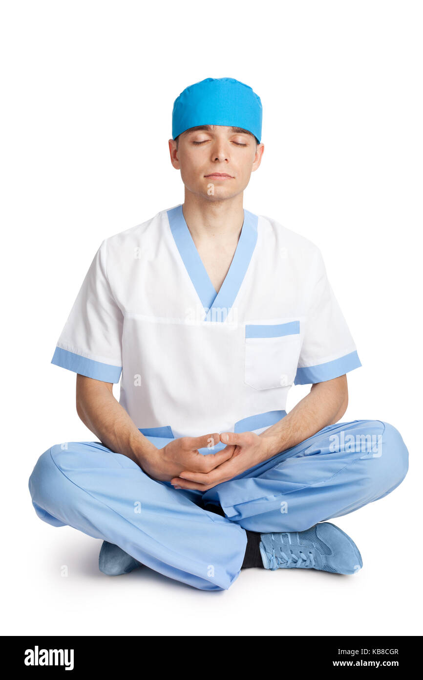 medical doctor meditating in lotus pose Stock Photo - Alamy