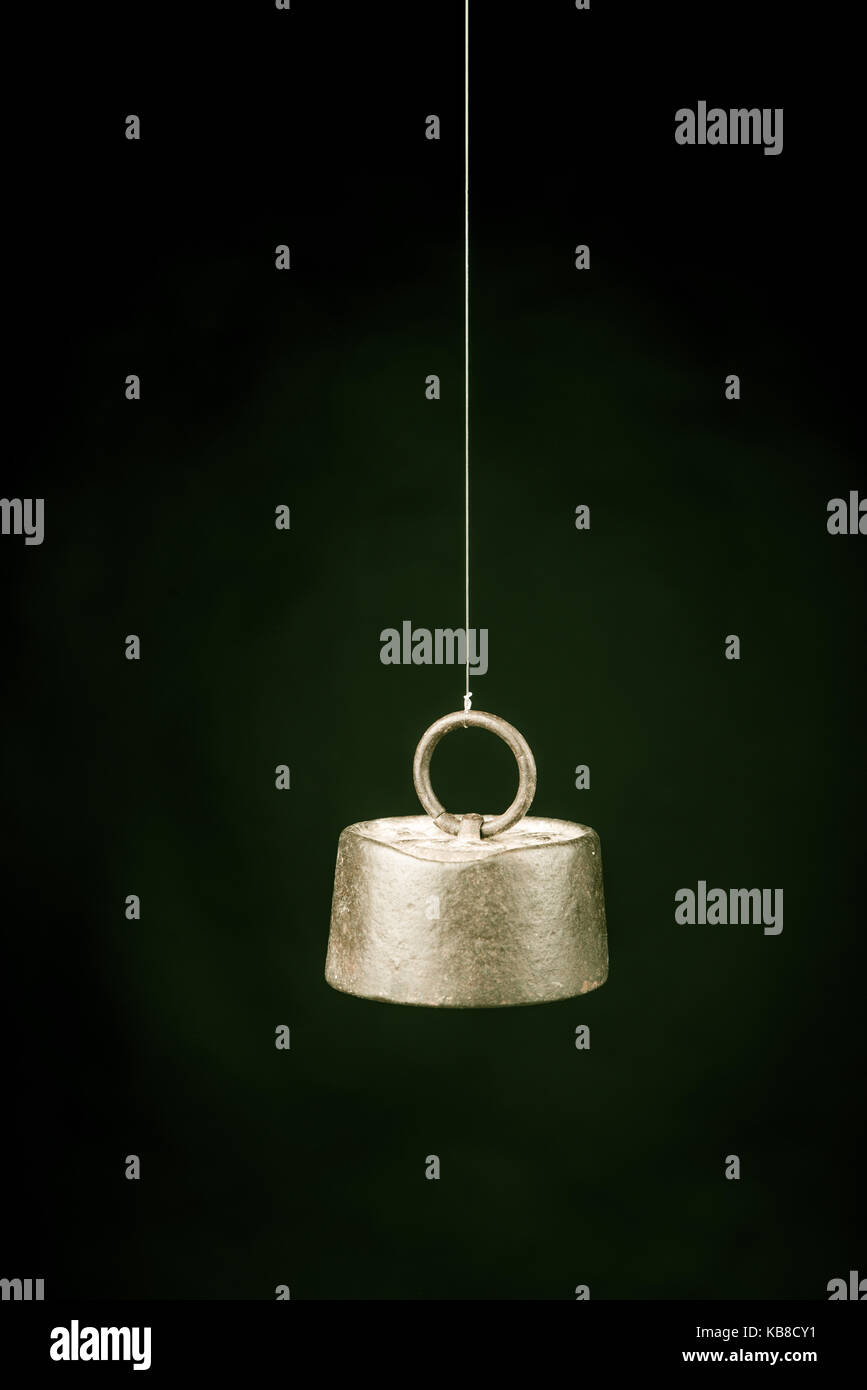 Hanging by a thread, a conceptual shot about extremely risky behaviour ...