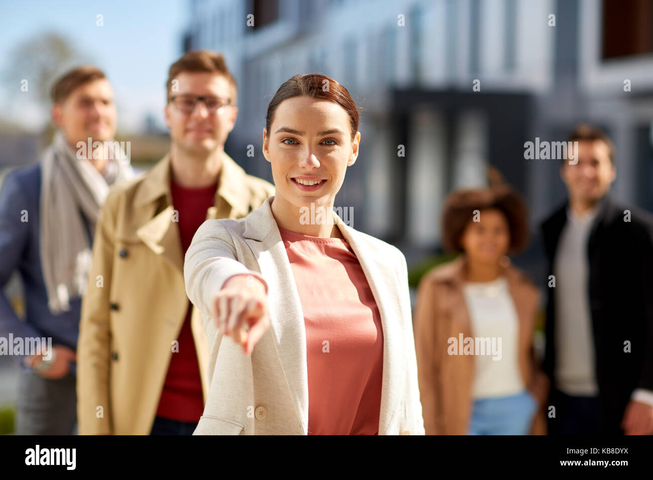 happy smiling woman pointing finger at you Stock Photo - Alamy