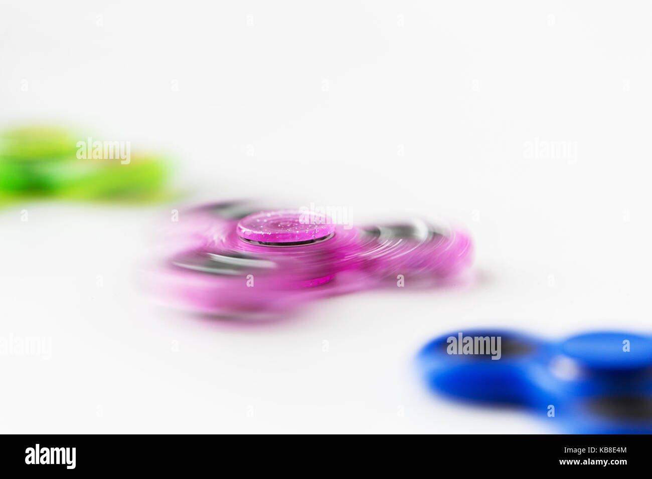 close up of spinning fidget spinners Stock Photo - Alamy