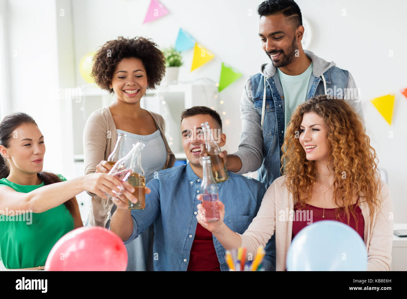 happy team with drinks celebrating at office party Stock Photo - Alamy