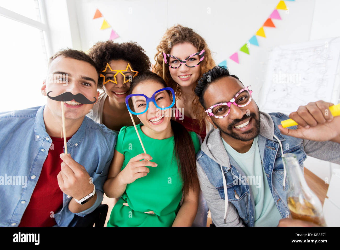 happy friends or team having fun at office party Stock Photo - Alamy