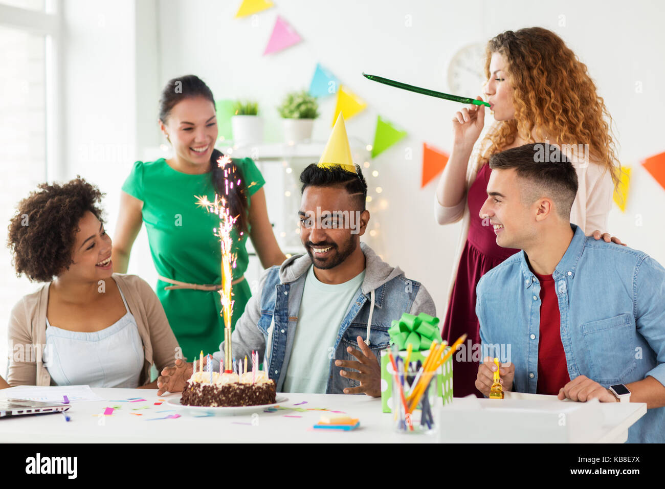 team greeting colleague at office birthday party Stock Photo - Alamy