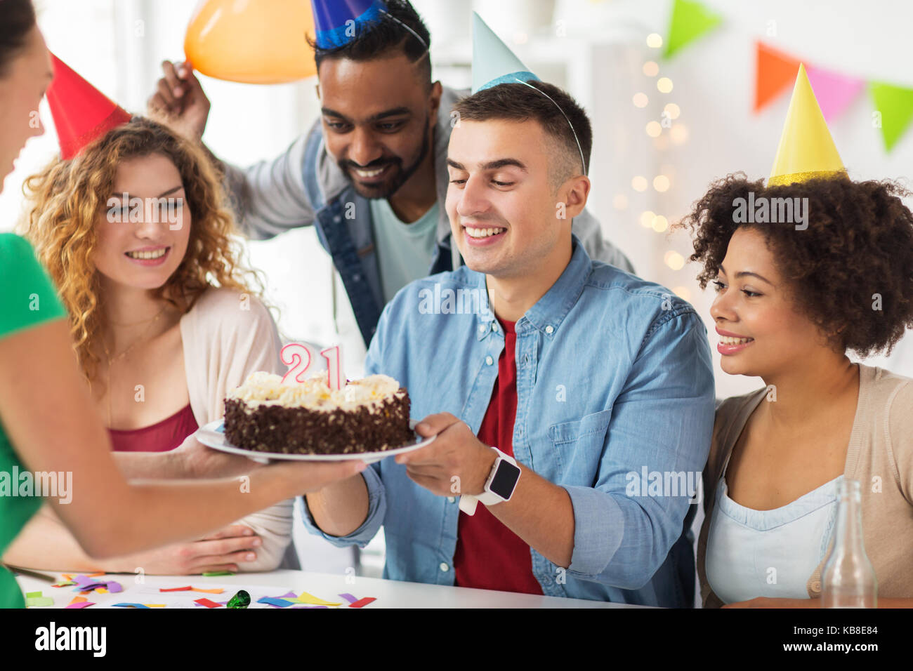 team greeting colleague at office birthday party Stock Photo - Alamy