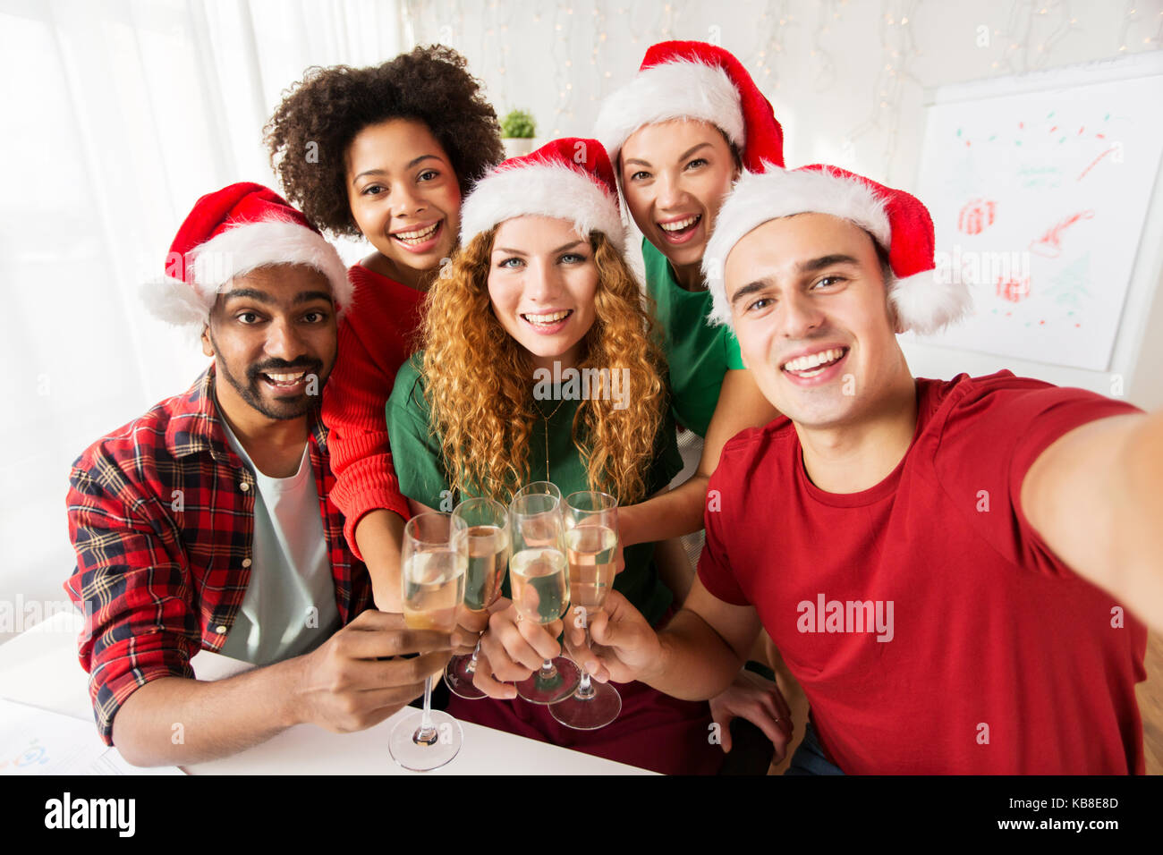 happy team celebrating christmas at office party Stock Photo - Alamy