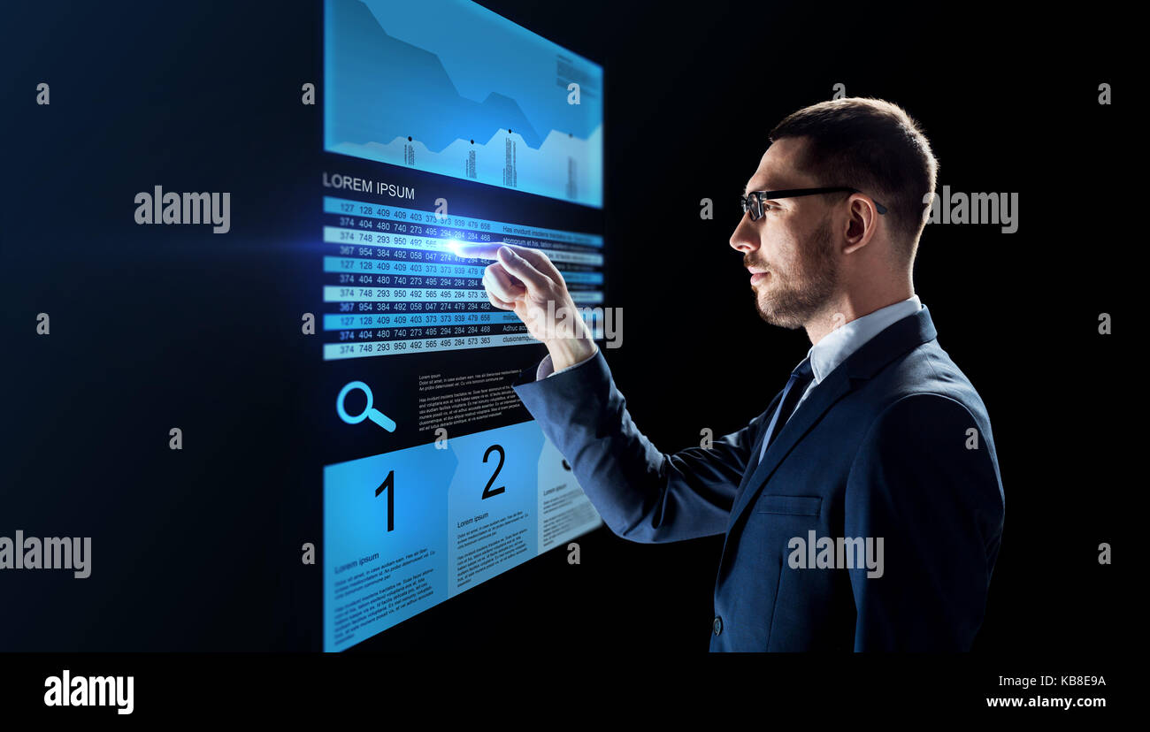businessman with stock charts on virtual screens Stock Photo - Alamy