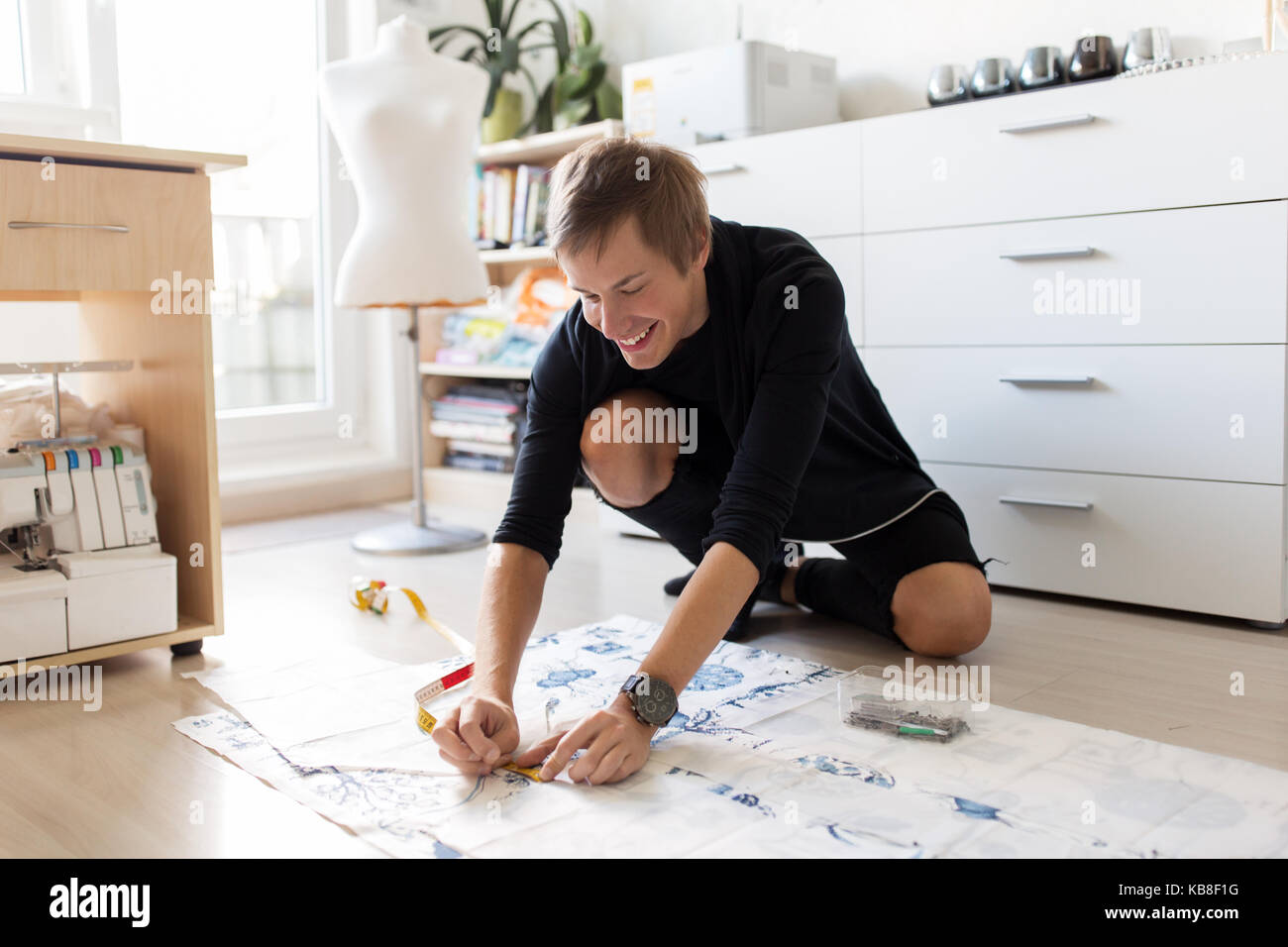 fashion designer making dress at sewing studio Stock Photo - Alamy