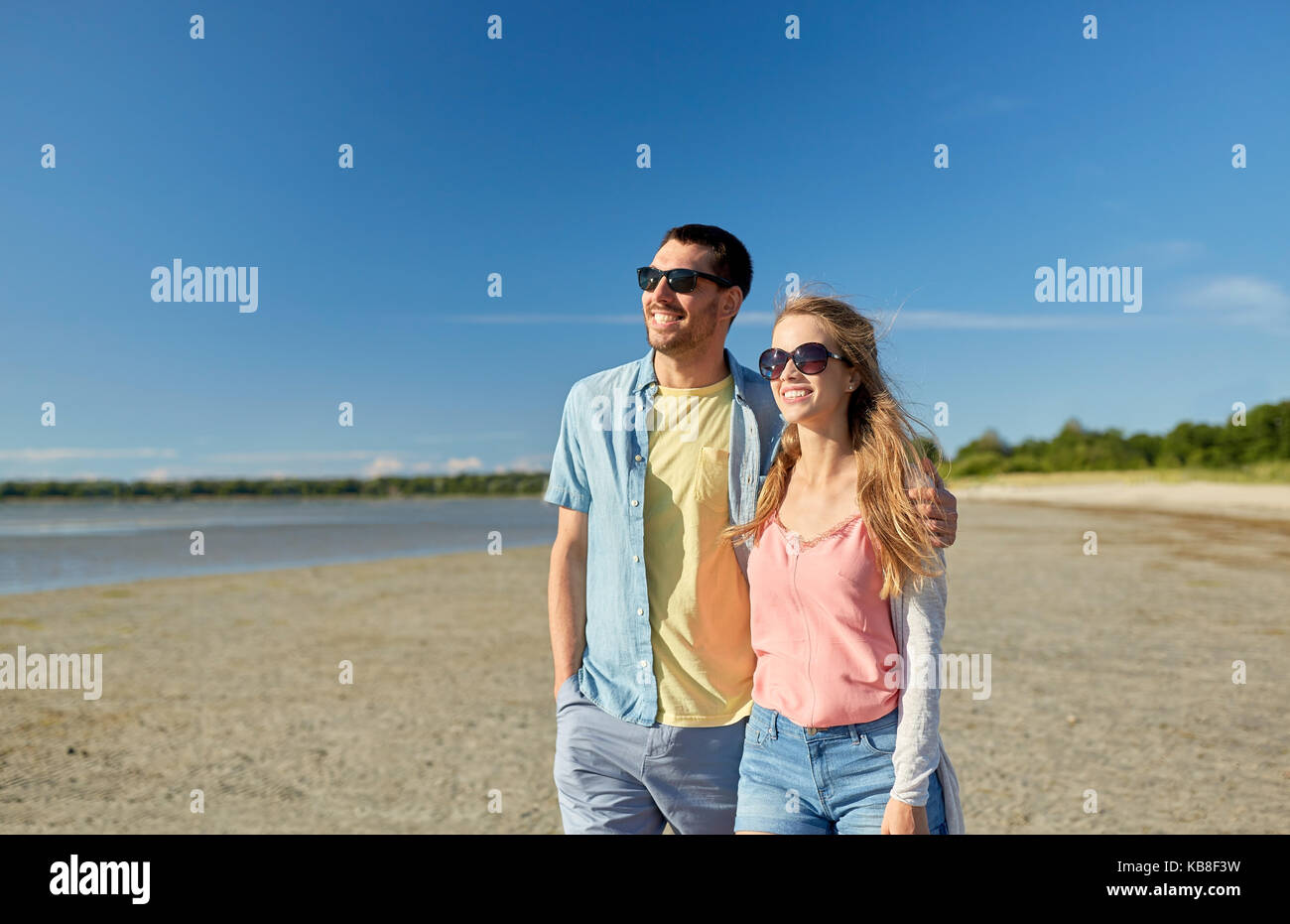 happy couple hugging on summer beach Stock Photo - Alamy