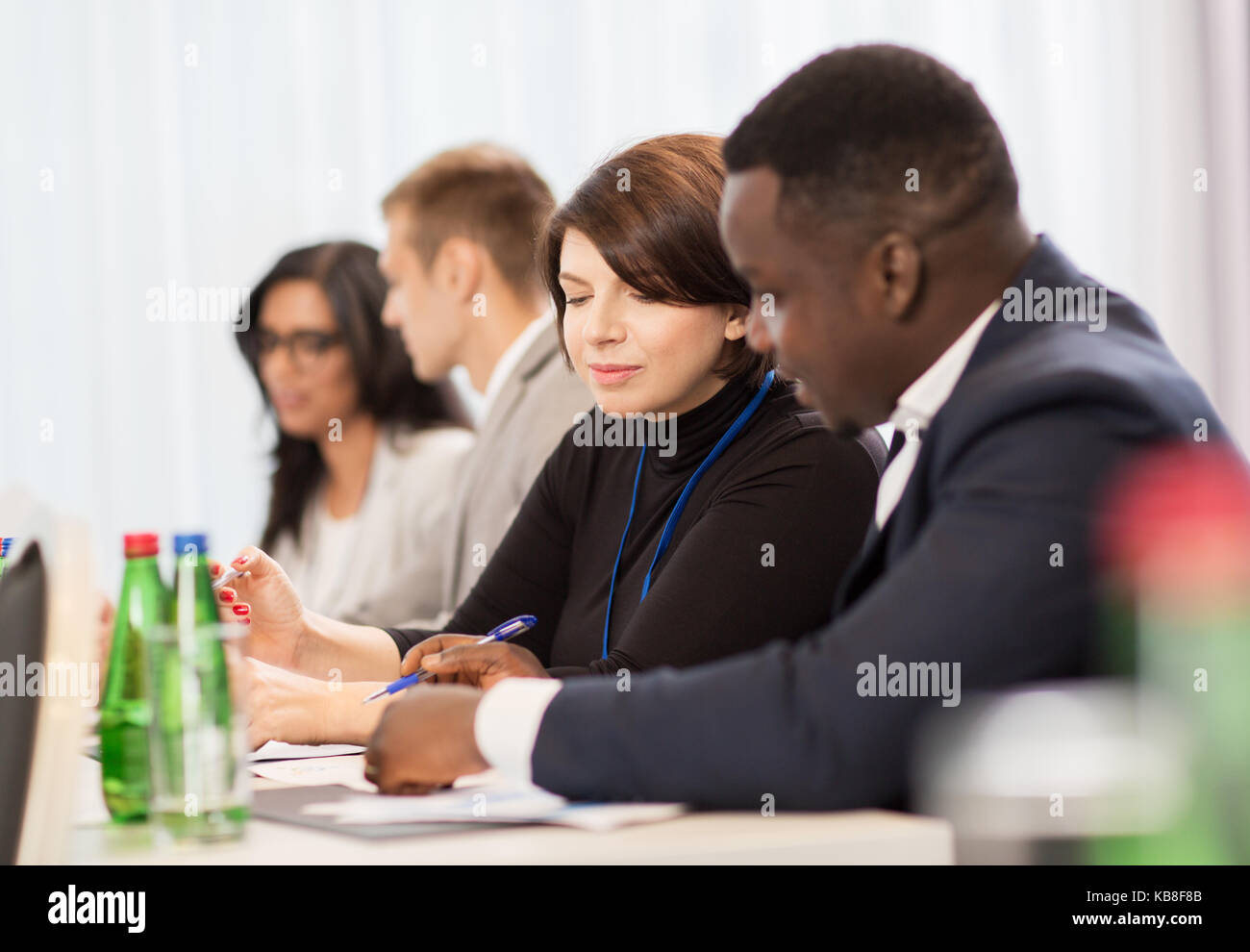 business team at international conference Stock Photo - Alamy
