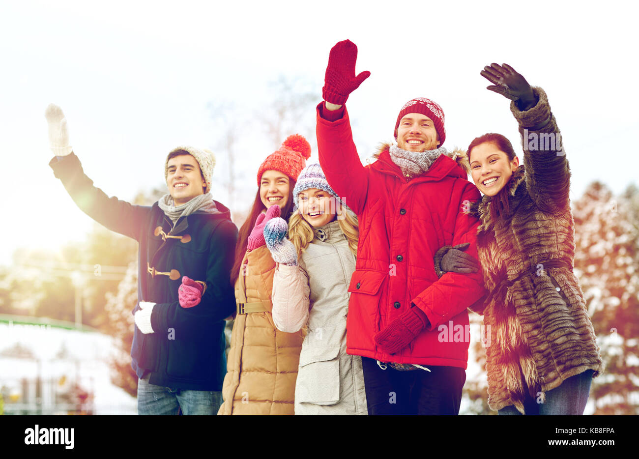 happy friends waving hands outdoors Stock Photo - Alamy
