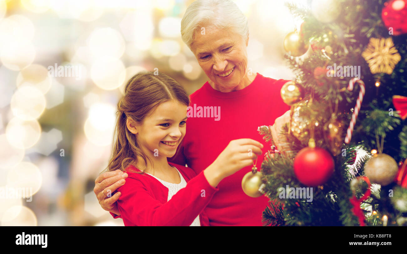 grandmother and granddaughter at christmas tree Stock Photo - Alamy