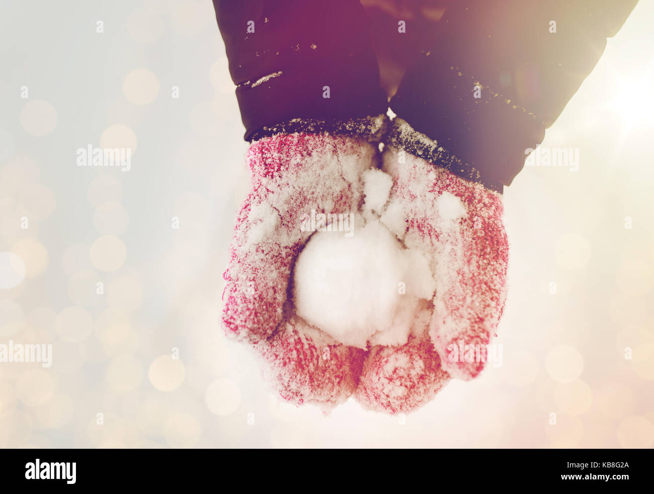 close up of woman holding snowball outdoors Stock Photo - Alamy