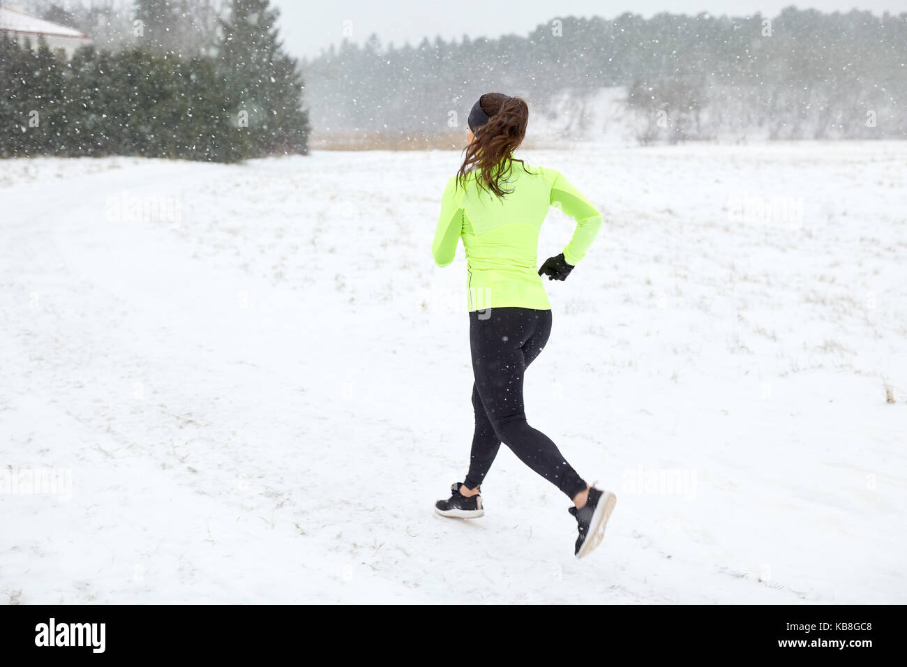 woman running outdoors in winter Stock Photo - Alamy