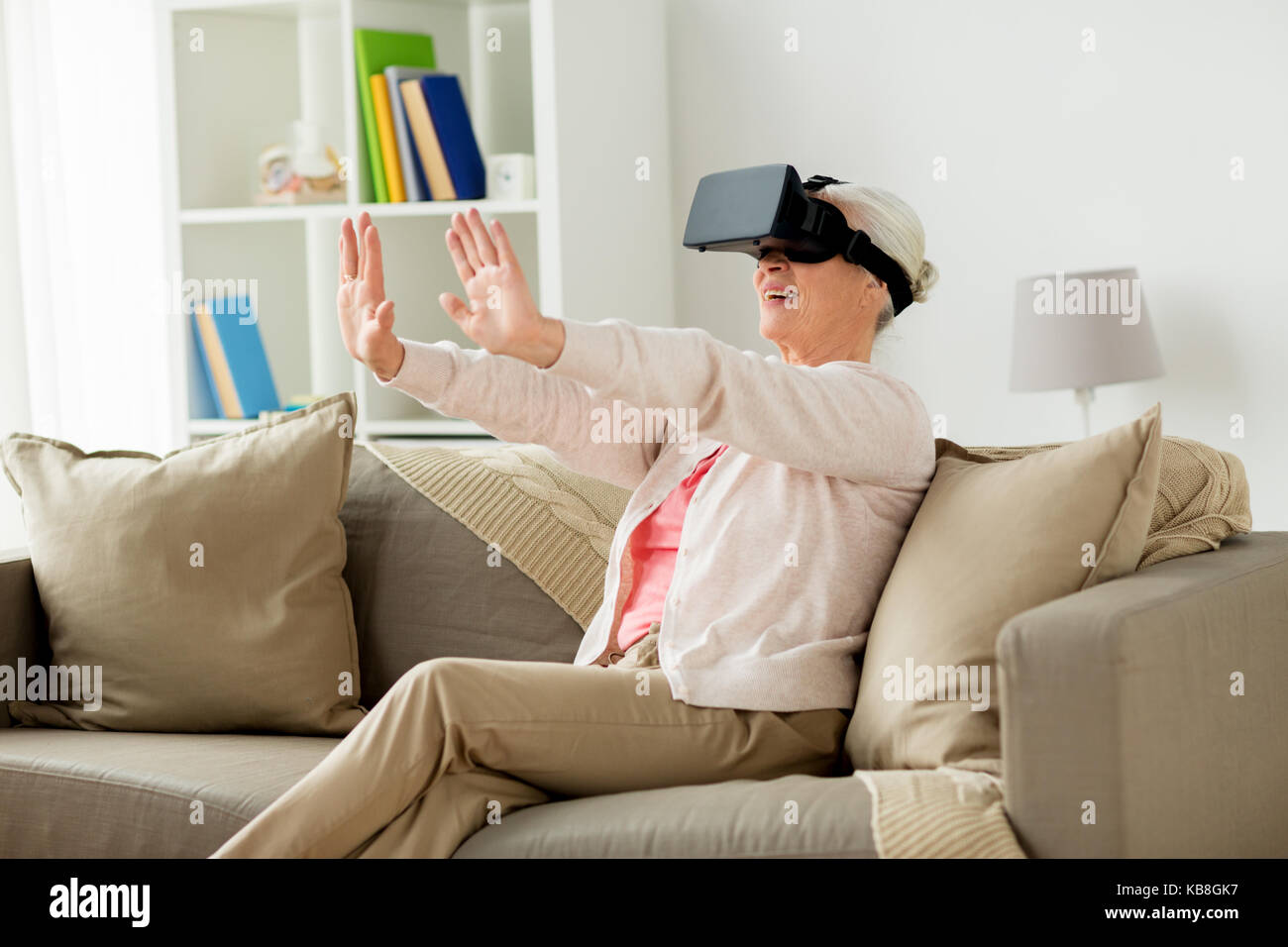 old woman in virtual reality headset or 3d glasses Stock Photo - Alamy