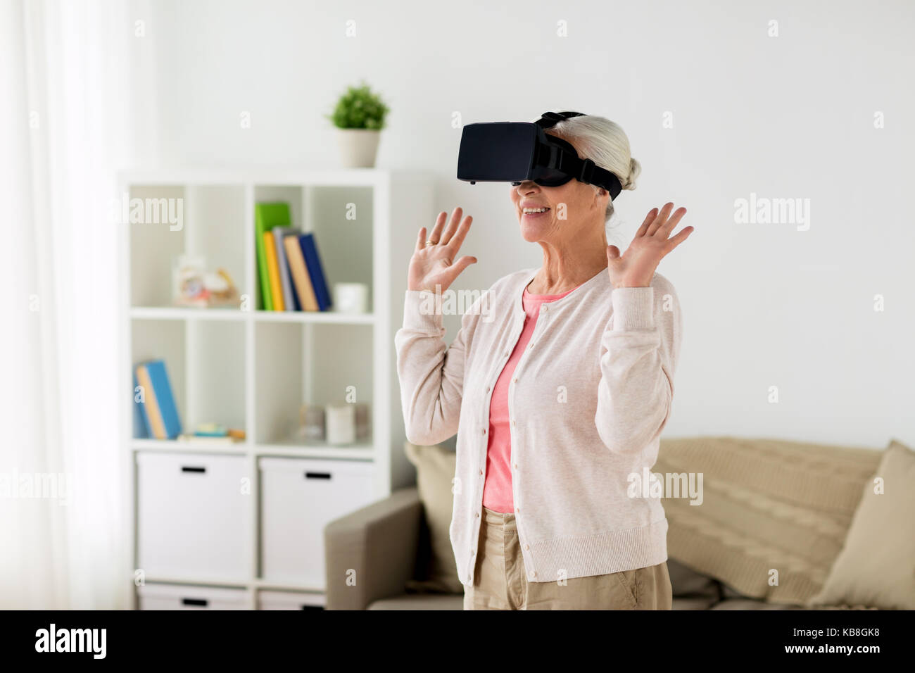 old woman in virtual reality headset or 3d glasses Stock Photo - Alamy