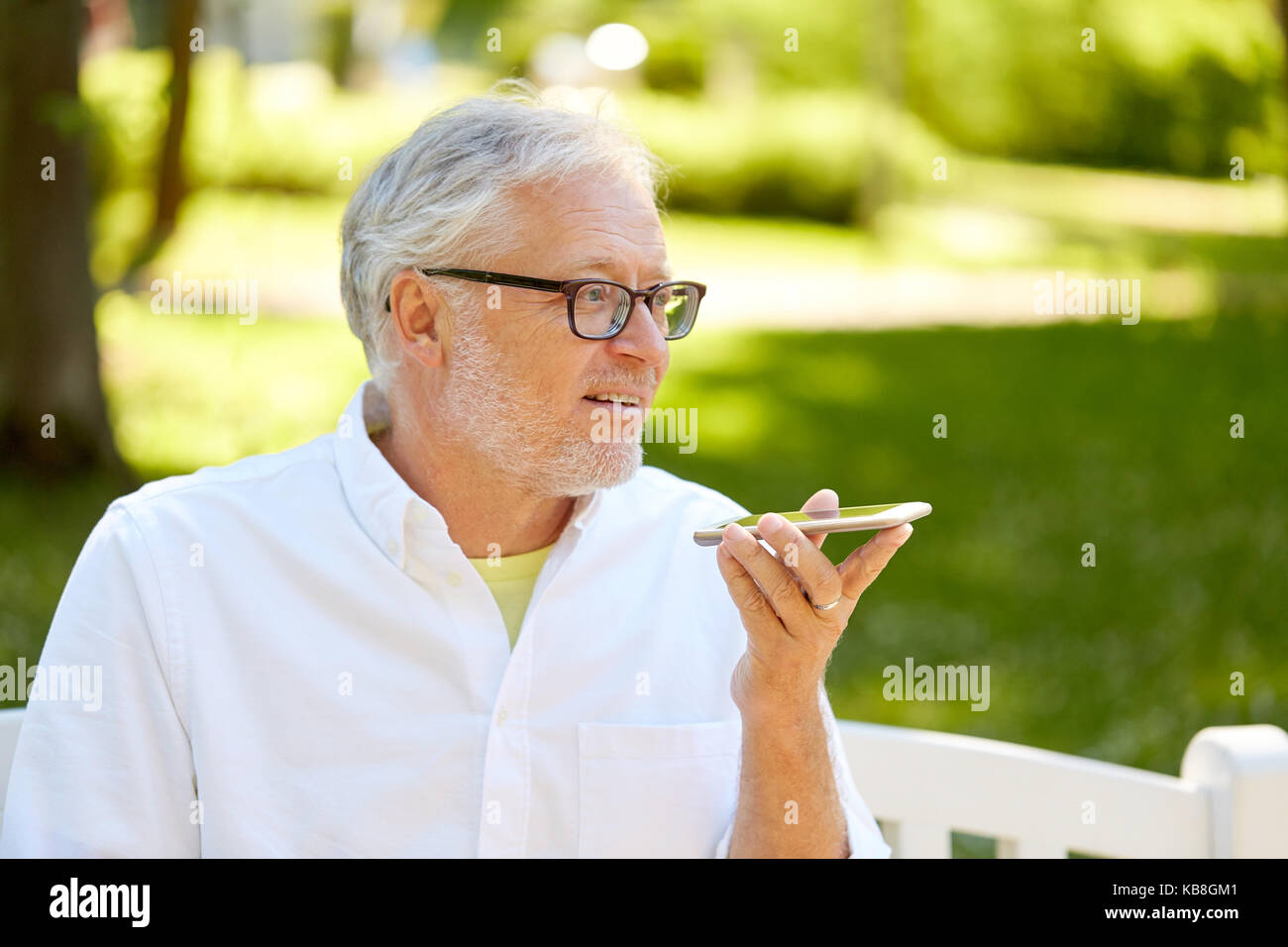 old man using voice command recorder on smartphone Stock Photo - Alamy
