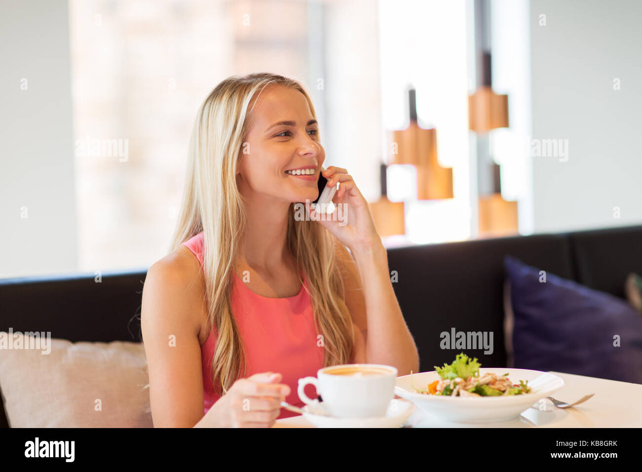 woman with coffee calling smartphone at restaurant Stock Photo - Alamy