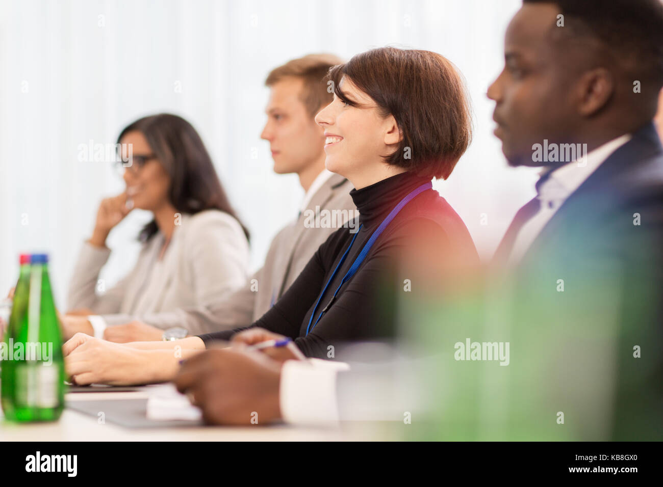 happy business team at international conference Stock Photo - Alamy