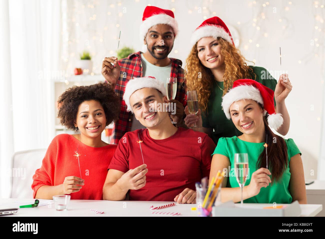 happy team celebrating christmas at office party Stock Photo - Alamy