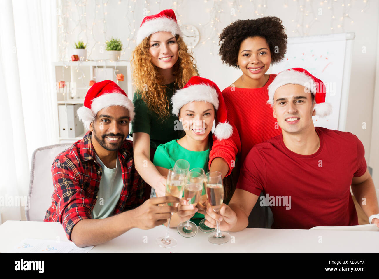 happy team celebrating christmas at office party Stock Photo - Alamy