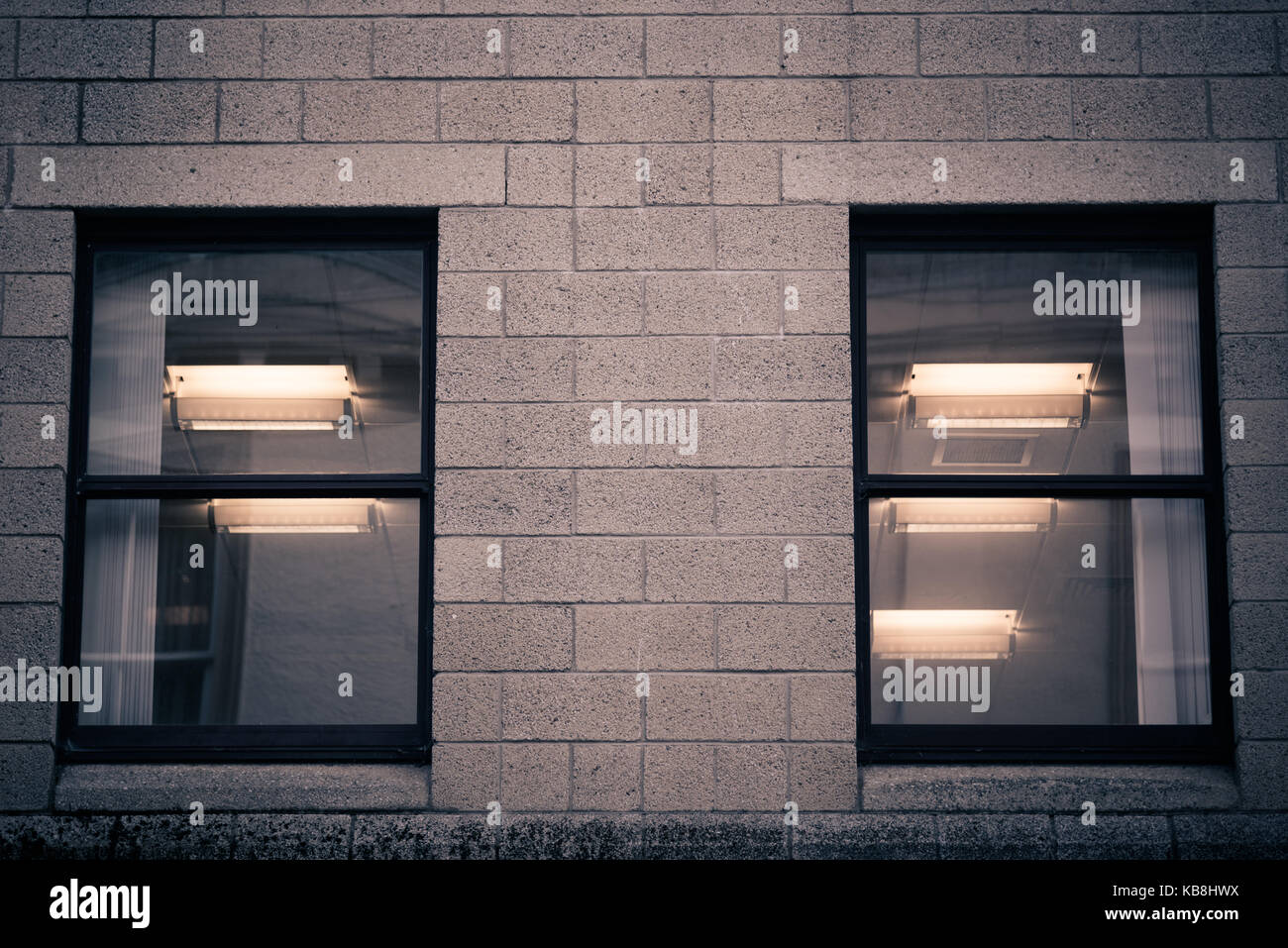 Close up of two window on a concrete wall Stock Photo - Alamy
