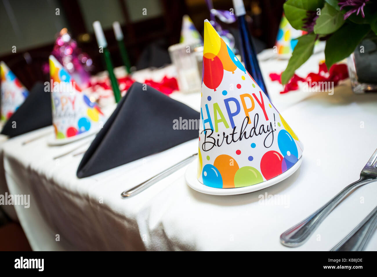 Festive birthday decorations on a restaurant table Stock Photo - Alamy