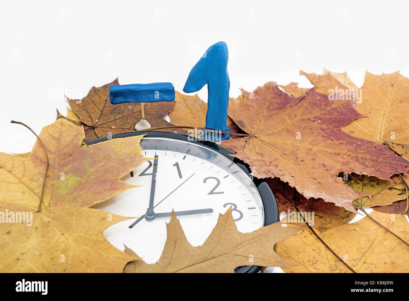 Daylight Saving Time. Wall Clock going to winter time Stock Photo - Alamy