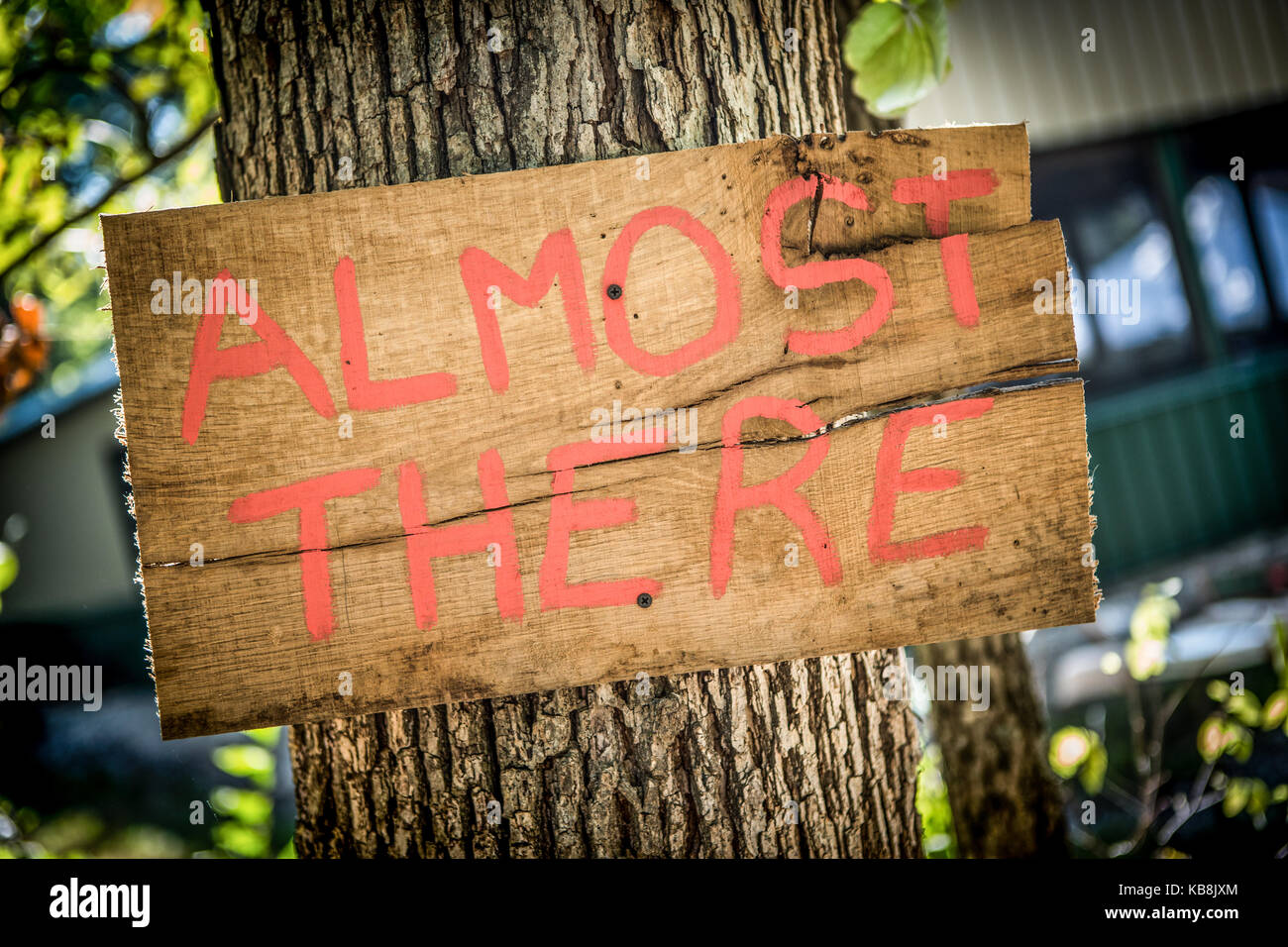 Homemade rustic wedding sign that says "Almost There Stock Photo - Alamy