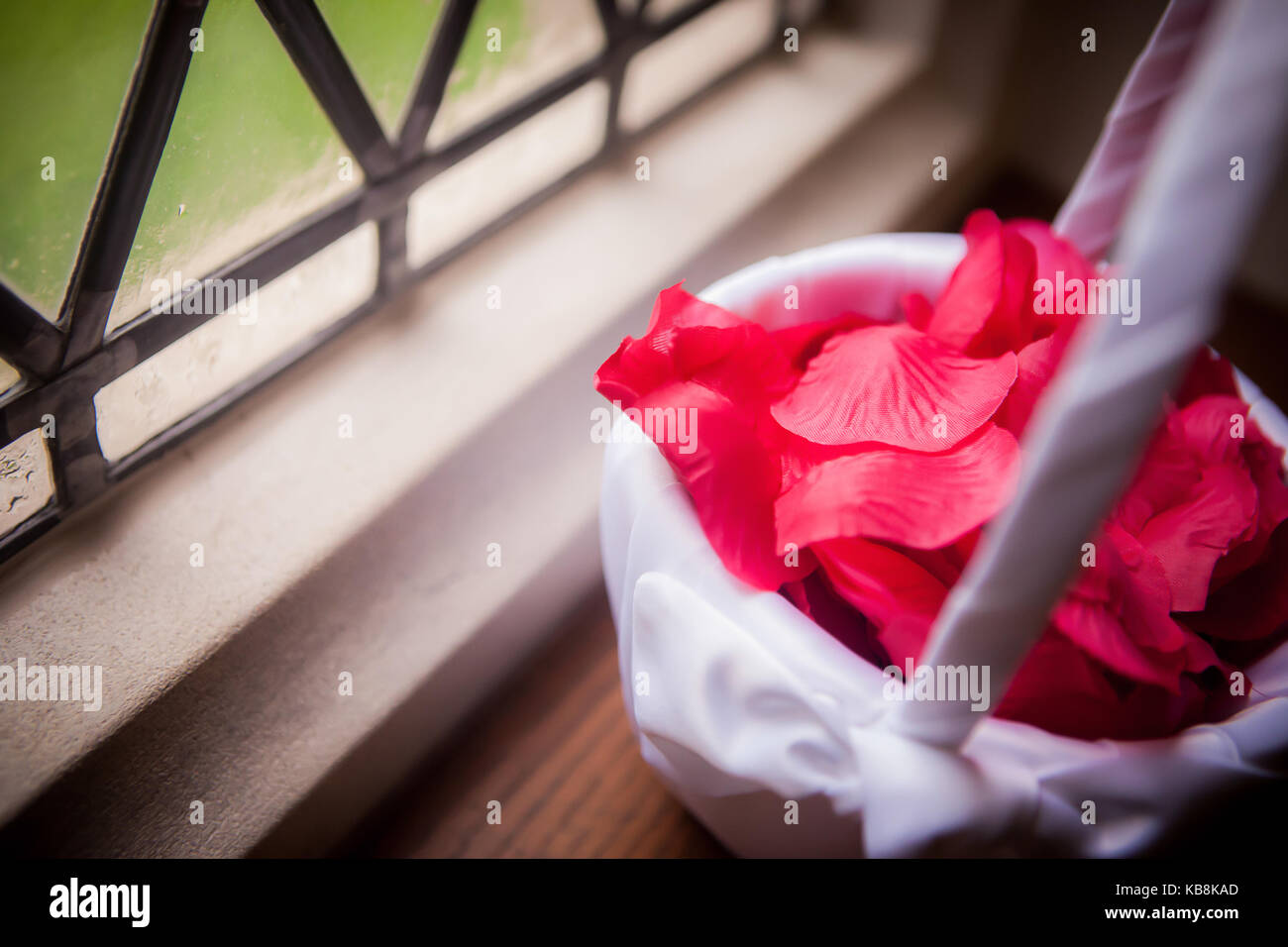 Rose Petals in Basket sitting on a window ledge Stock Photo - Alamy