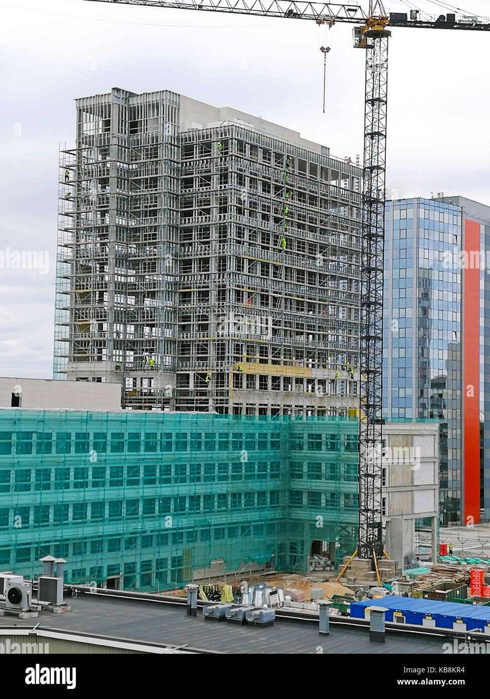 Business House building process. Urban city buildings Stock Photo - Alamy