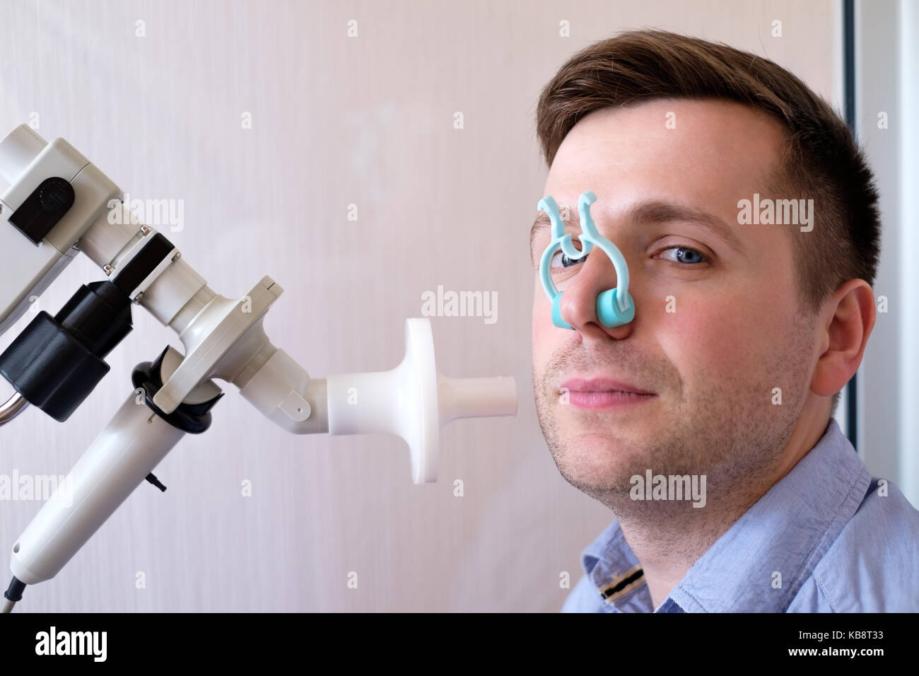 Young man testing breathing function by spirometry Stock Photo - Alamy