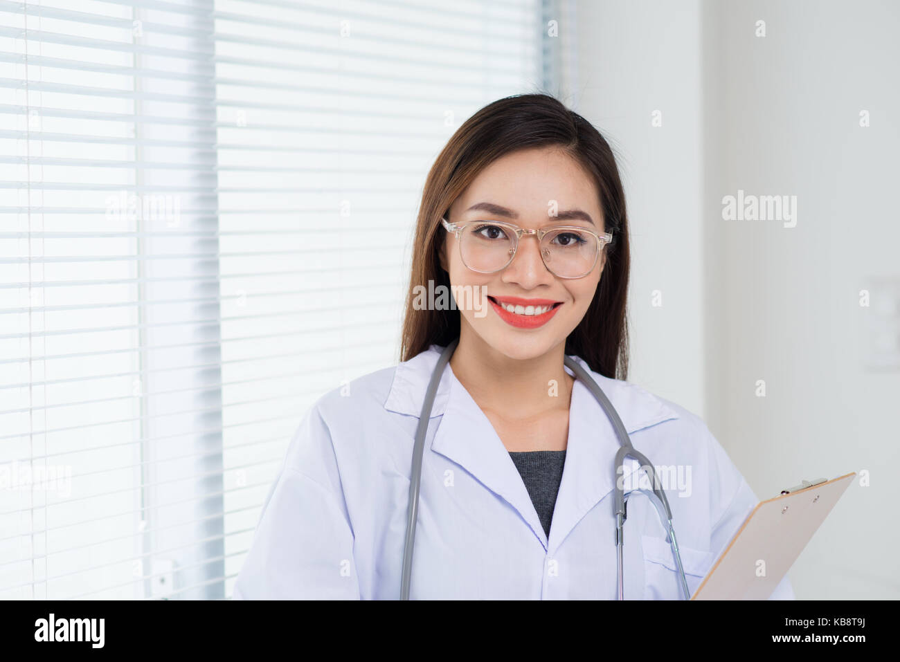 Portrait confident young female doctor medical professional Stock Photo ...