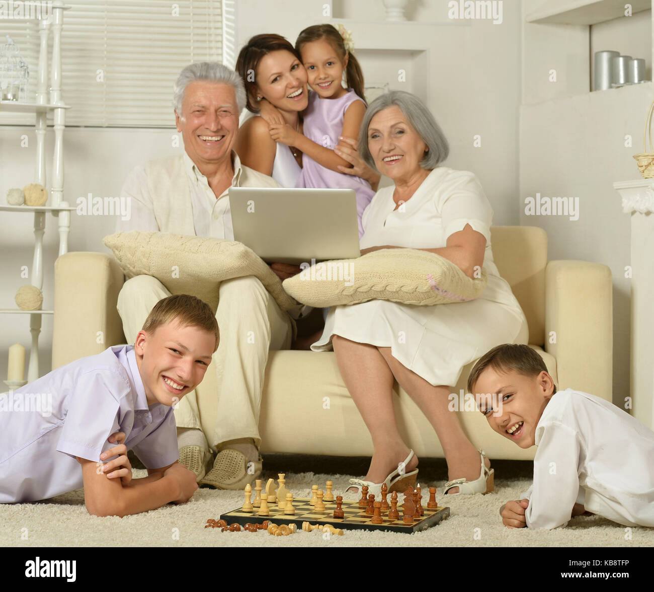 Happy big family sitting hi-res stock photography and images - Alamy