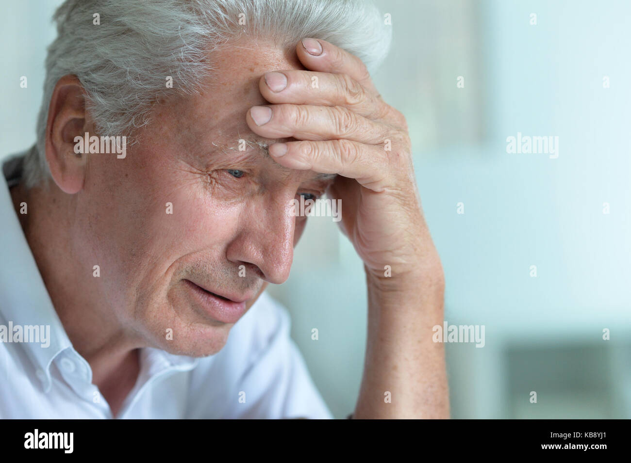 Sad senior man at home Stock Photo - Alamy