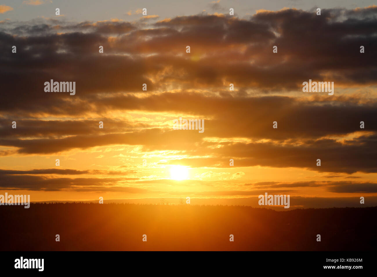 Beautiful bright sunset photo Stock Photo - Alamy