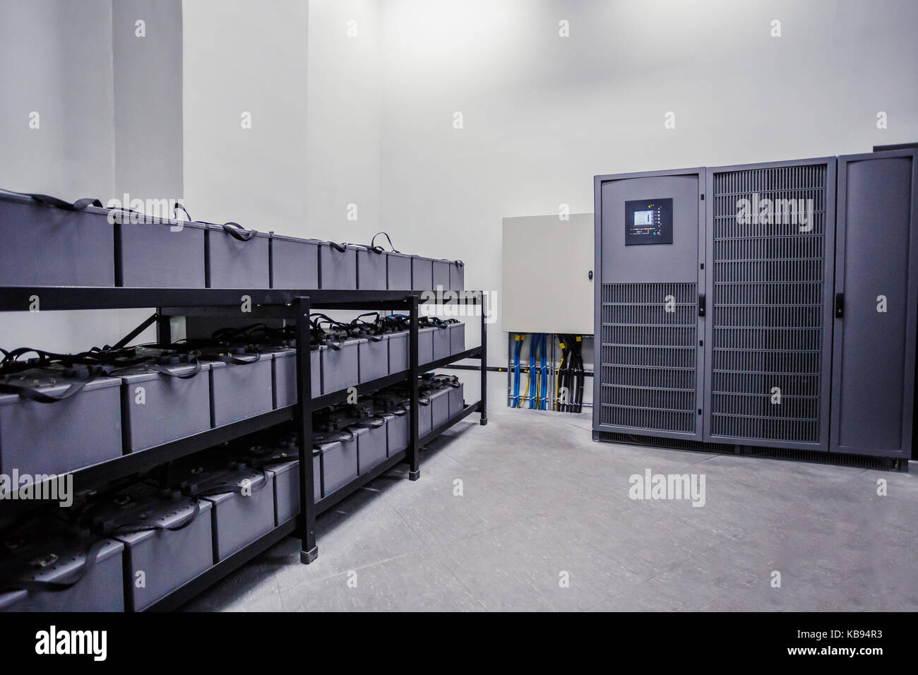 Room with many cables and many batteries. Backup power for larger ...