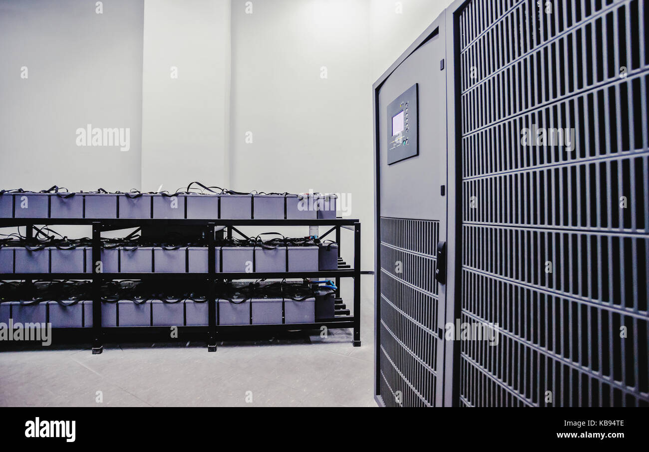 Room with many cables and many batteries. Backup power for larger ...